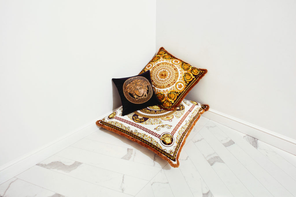 Designer home decor like Versace pillows & Loewe pots