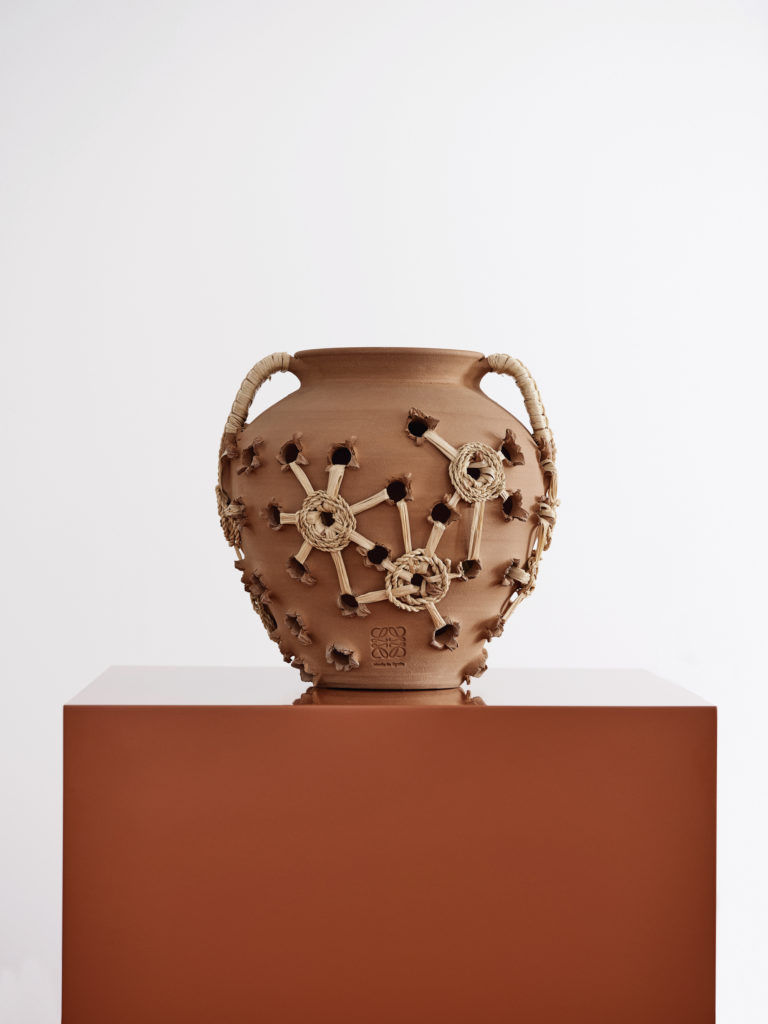 Designer home decor like Versace pillows & Loewe pots