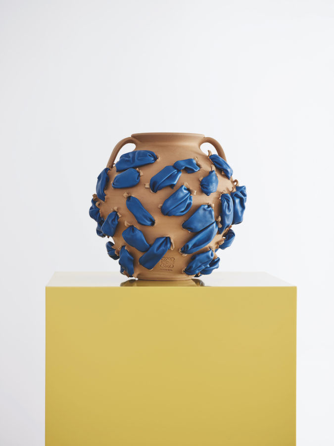 Designer home decor like Versace pillows & Loewe pots